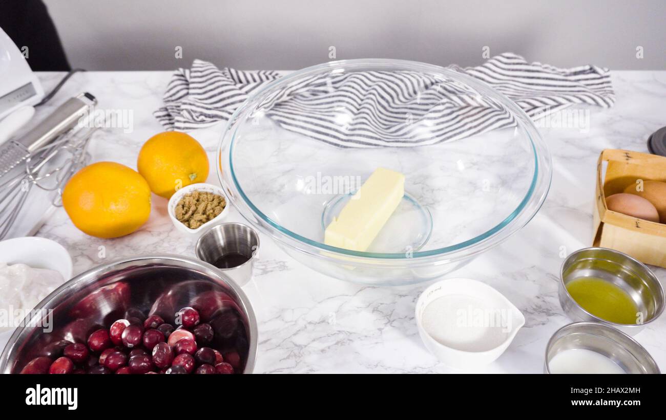 Step by step. Mixing ingredients in a mixing bowl to bake cranberry ...