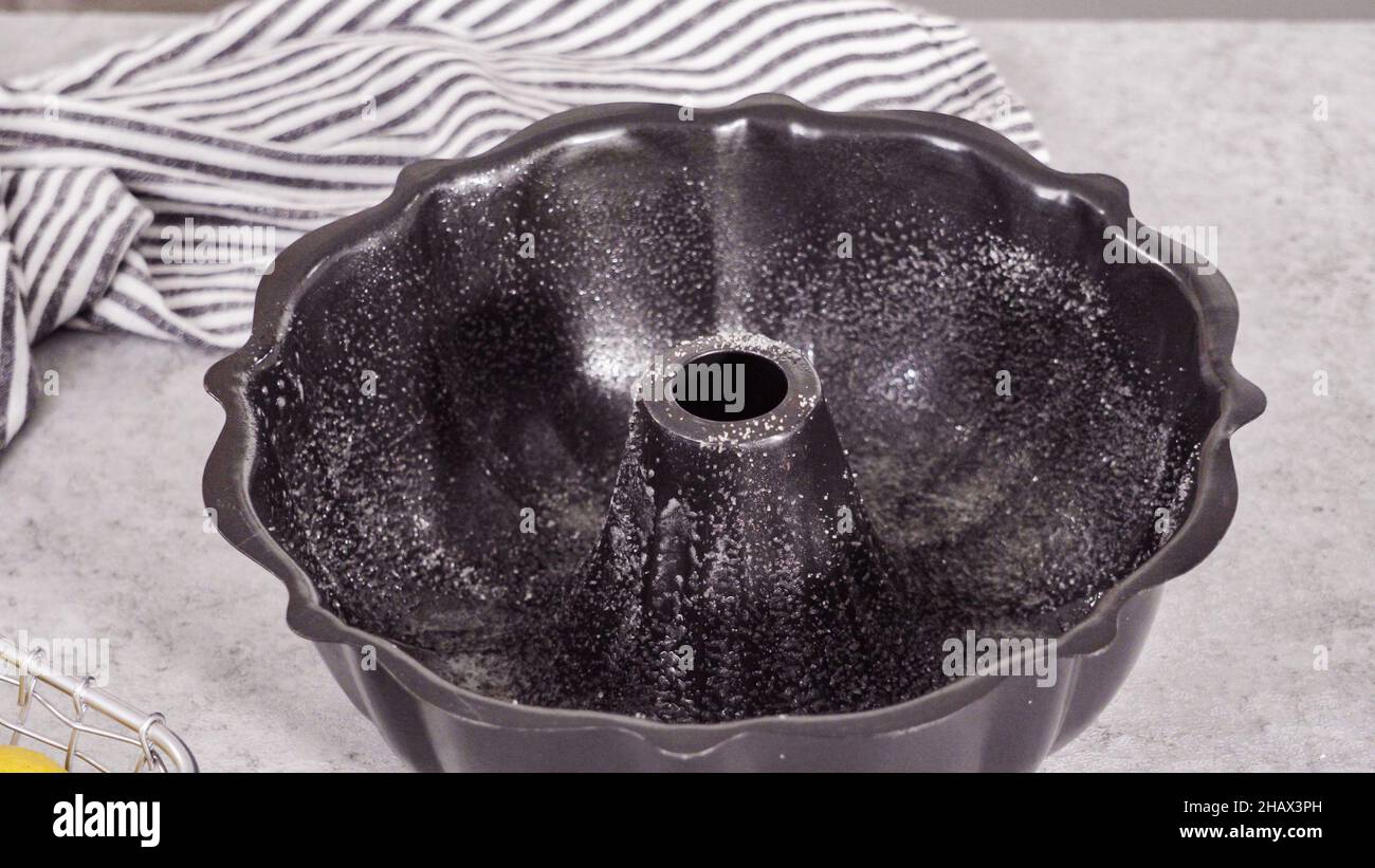 Empty baking pan prepared to bake a lemon pound cake Stock Photo - Alamy