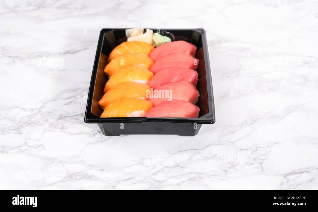 Pre-packaged sushi in a plastic tray Stock Photo - Alamy