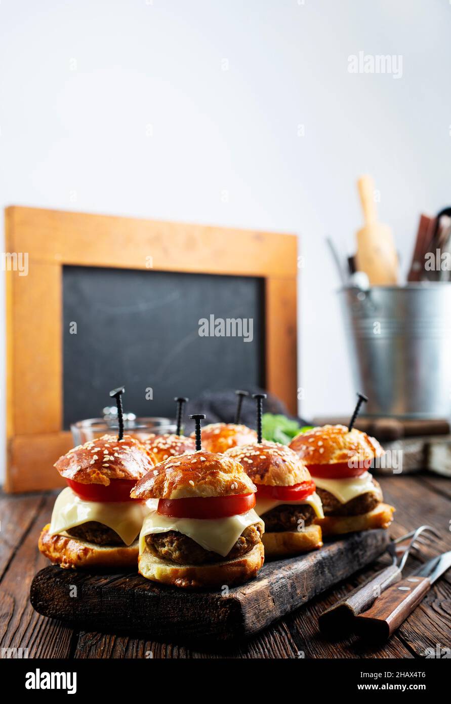 mini hamburgers sliders, mini burgers on board Stock Photo - Alamy