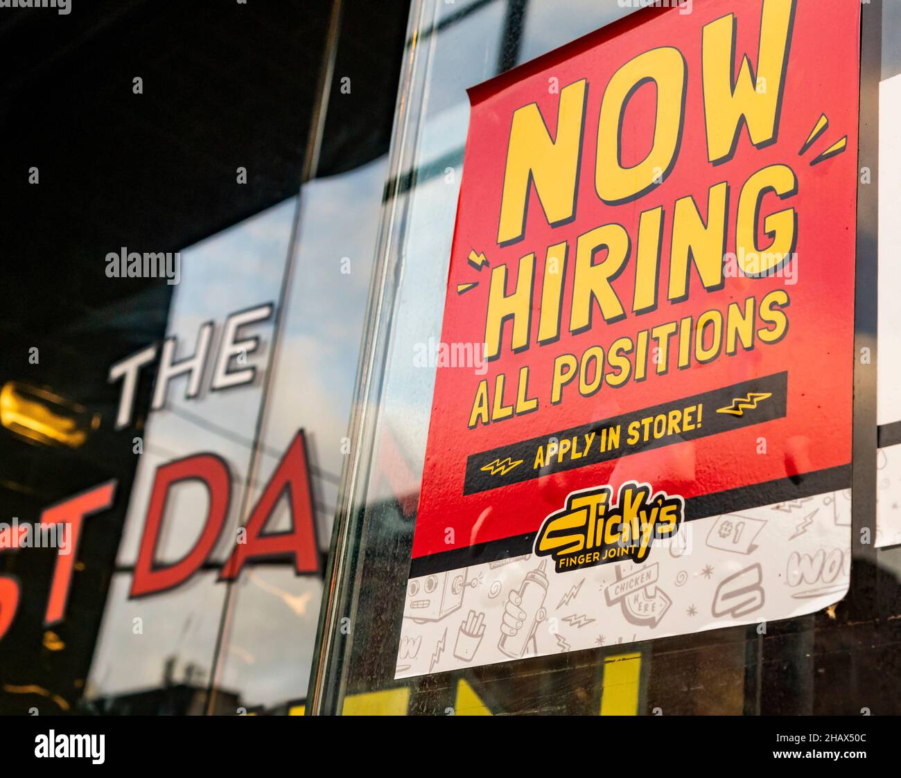 A sign on the window of a fast food restaurant in the Hell’s Kitchen ...