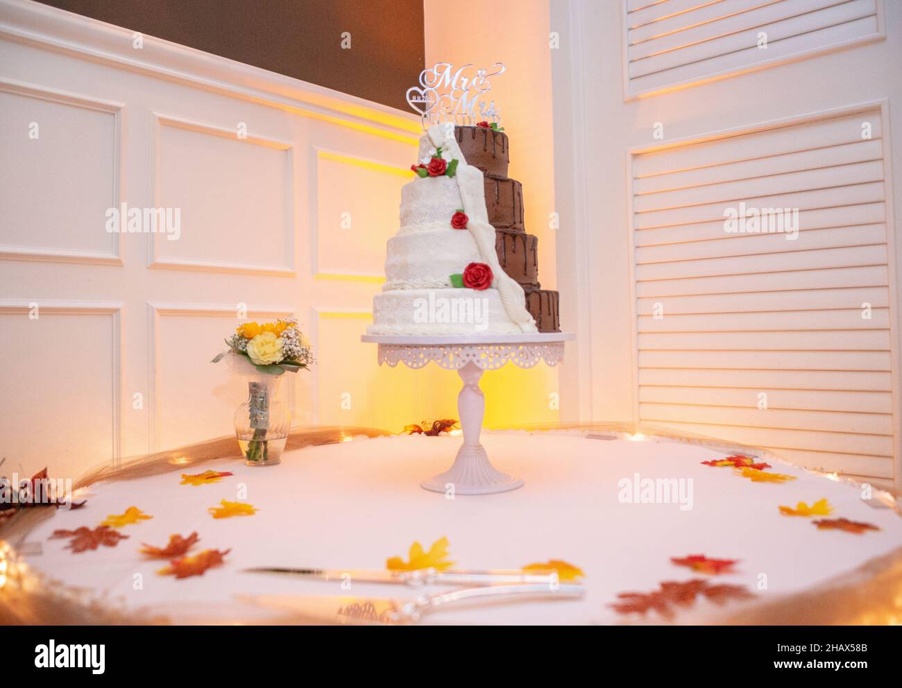 Split vanilla and chocolate four tier wedding cake Stock Photo - Alamy
