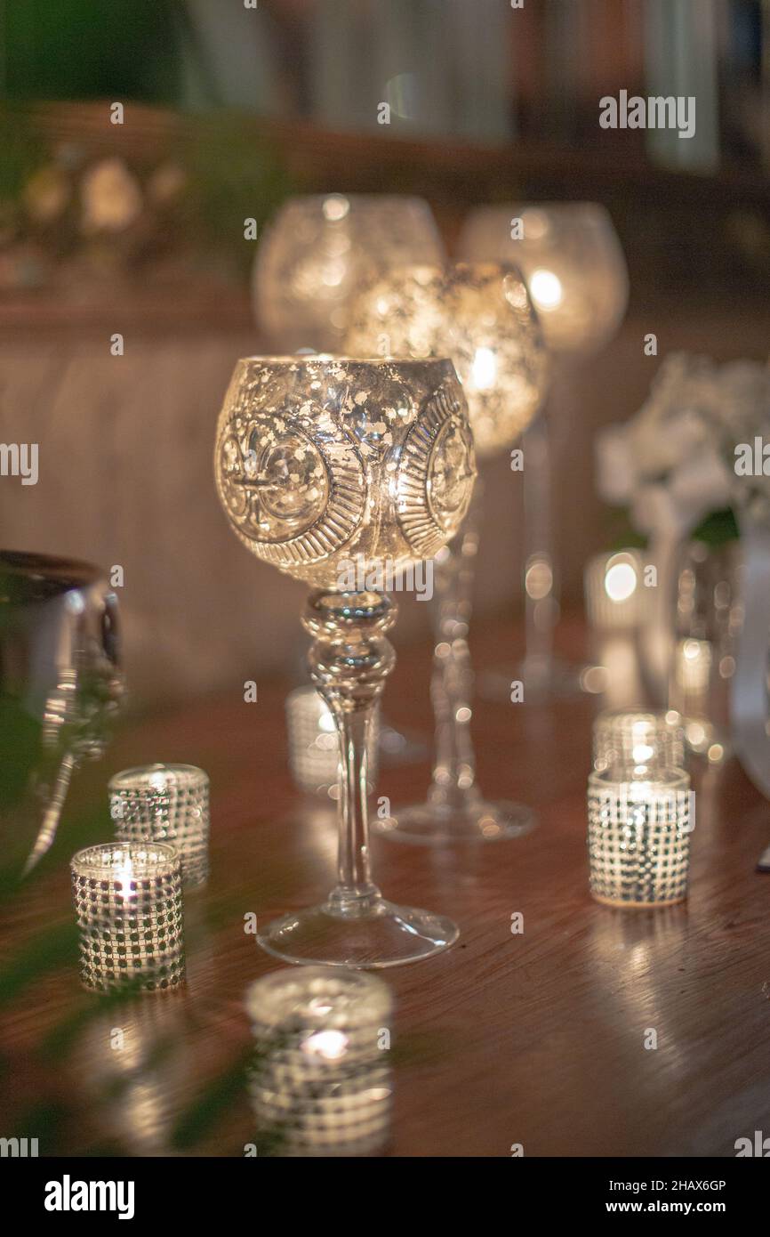 Three glass candle holder centerpiece Stock Photo - Alamy