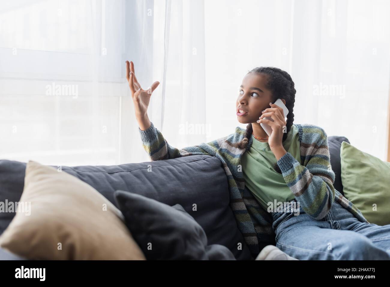 angry african american teenage girl gesturing while talking on mobile ...