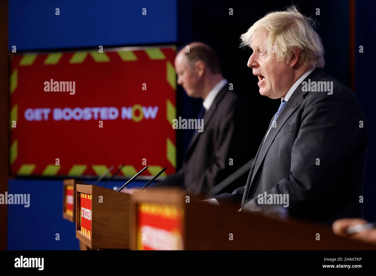 Chief Medical Officer for England Professor Chris Whitty (left) listens ...