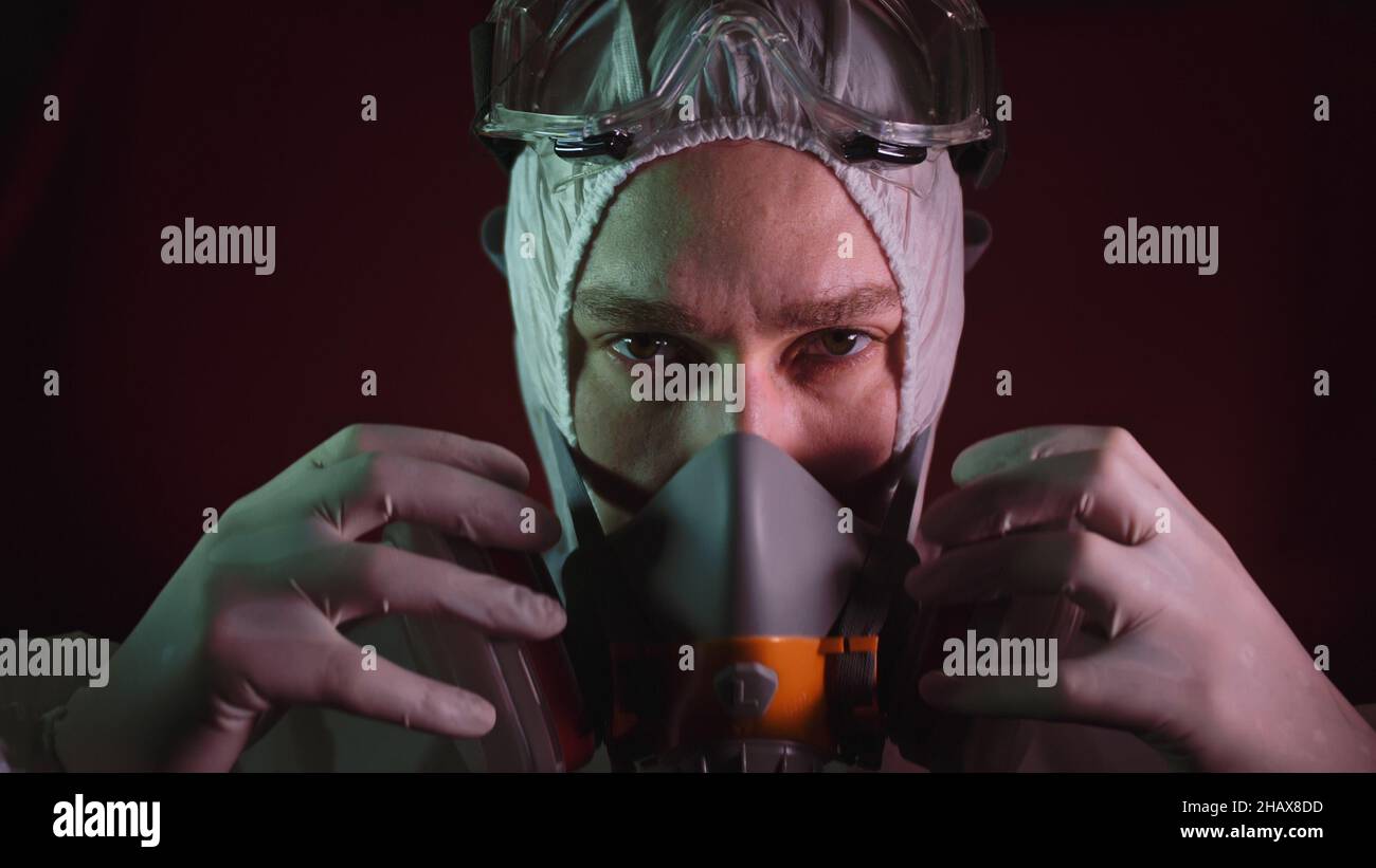 Man in protective costume suit, gas protect medical antibacterial ...