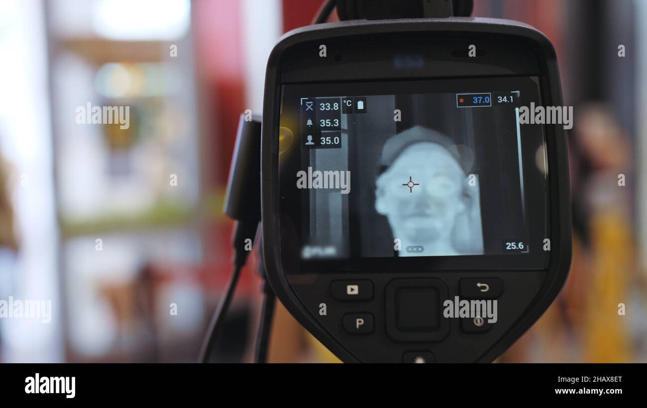 Temperature check at a supermarket, grocery store with a thermal ...