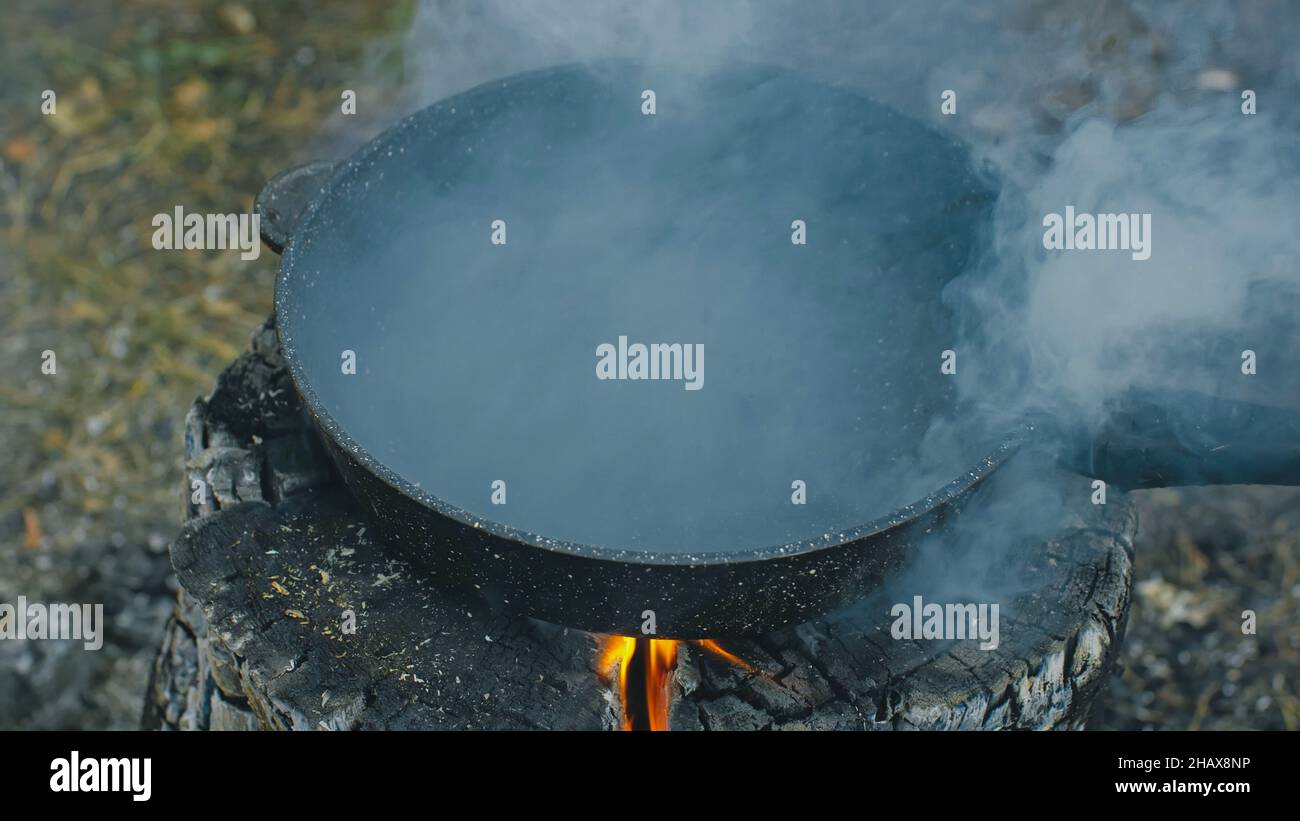 Swedish or finnish log candle. Fire burning from inside the wooden log ...