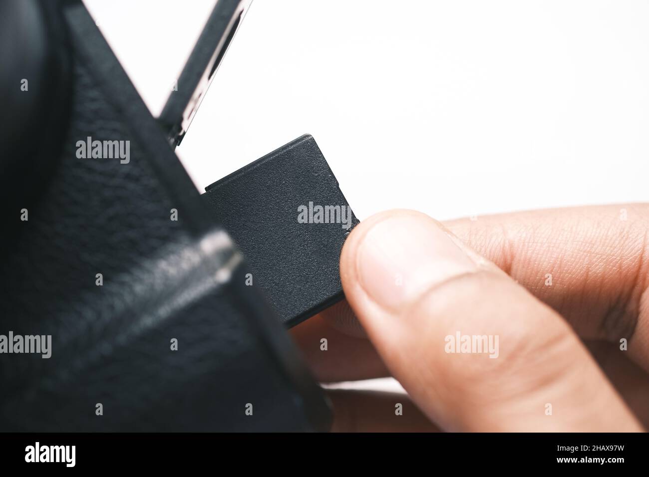 Putting SD memory card in a camera Stock Photo - Alamy