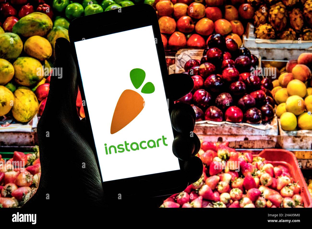 In this photo illustration a Instacart logo seen displayed on a ...