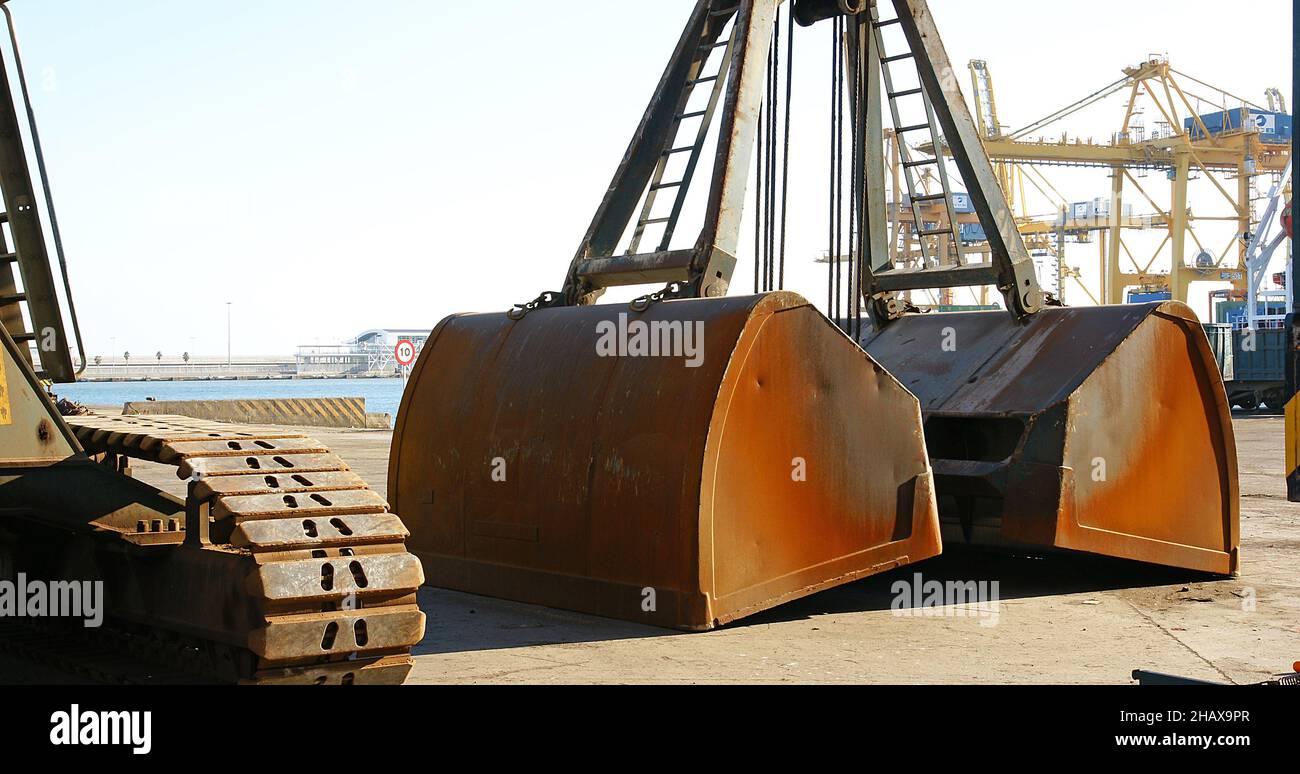 Spare shovel and chained of a crane in the industrial area of the port ...