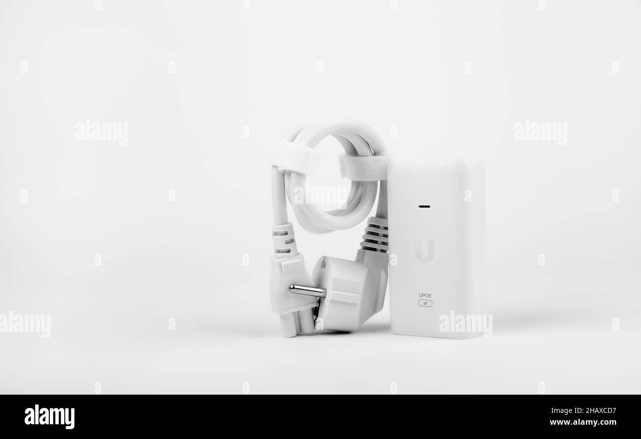White PoE injector for electronic equipment on a white background Stock ...