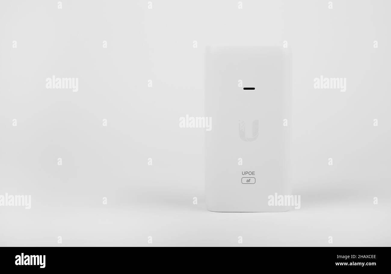 White PoE injector for electronic equipment on a white background Stock ...