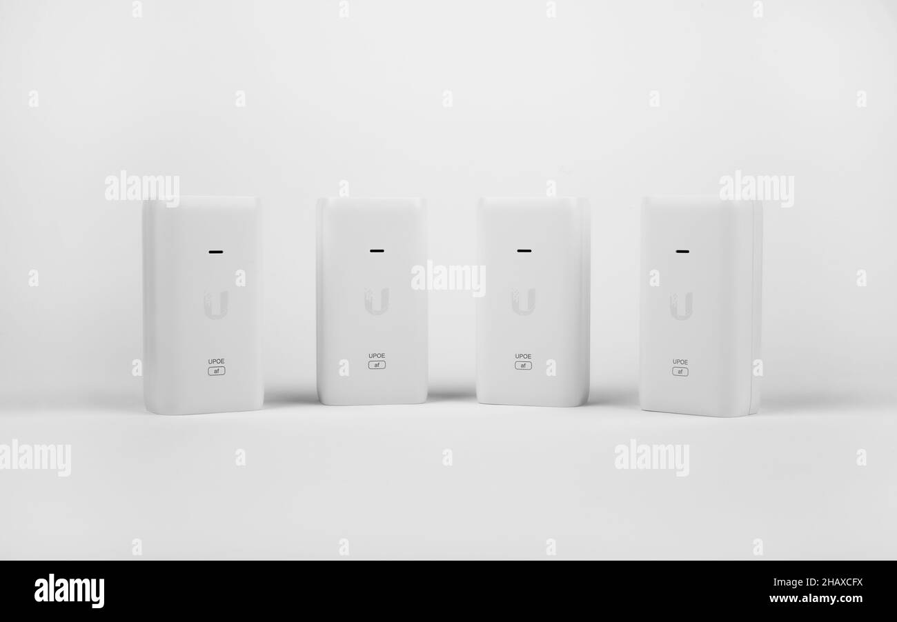 White PoE injector for electronic equipment on a white background Stock ...