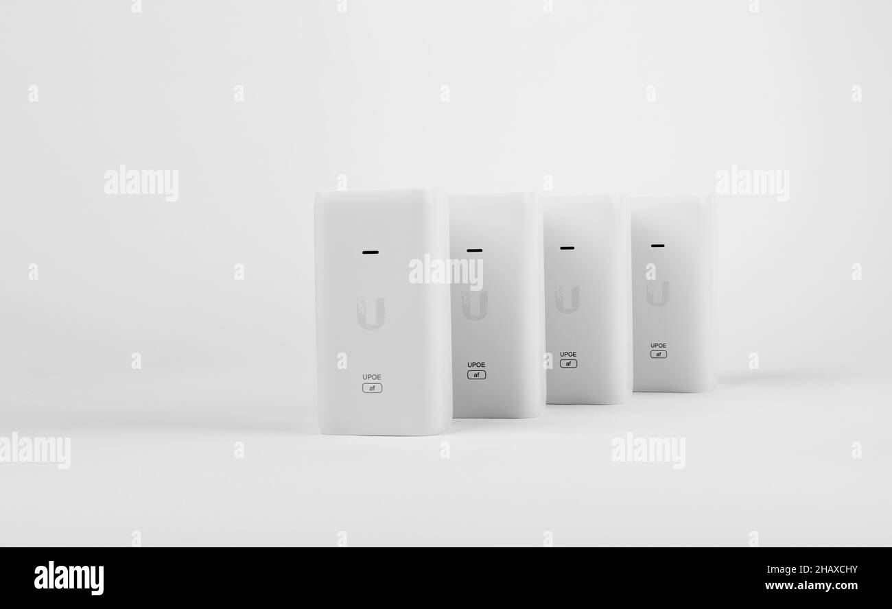 White PoE injector for electronic equipment on a white background Stock ...