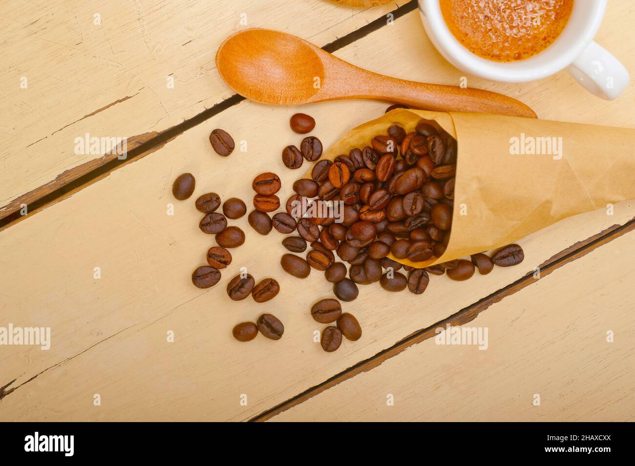 espresso coffee and beans on a paper cone cornucopia over white ...