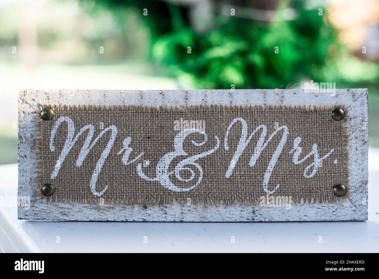 Canvass "mr & Mrs sign nailed to white square weathered piece of wood ...