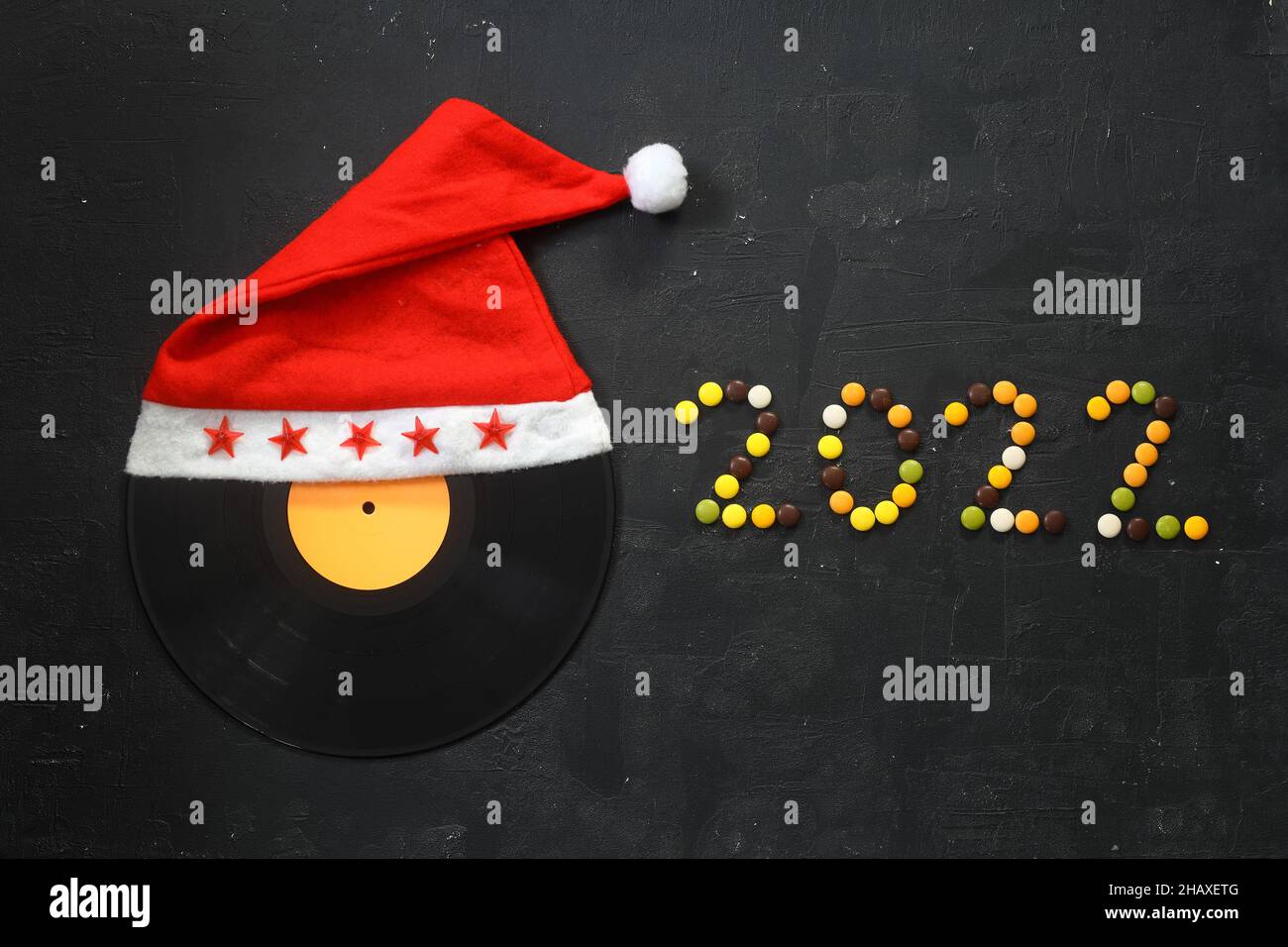 Happy New Years 2022. Christmas background with santa claus hats, vinyl ...