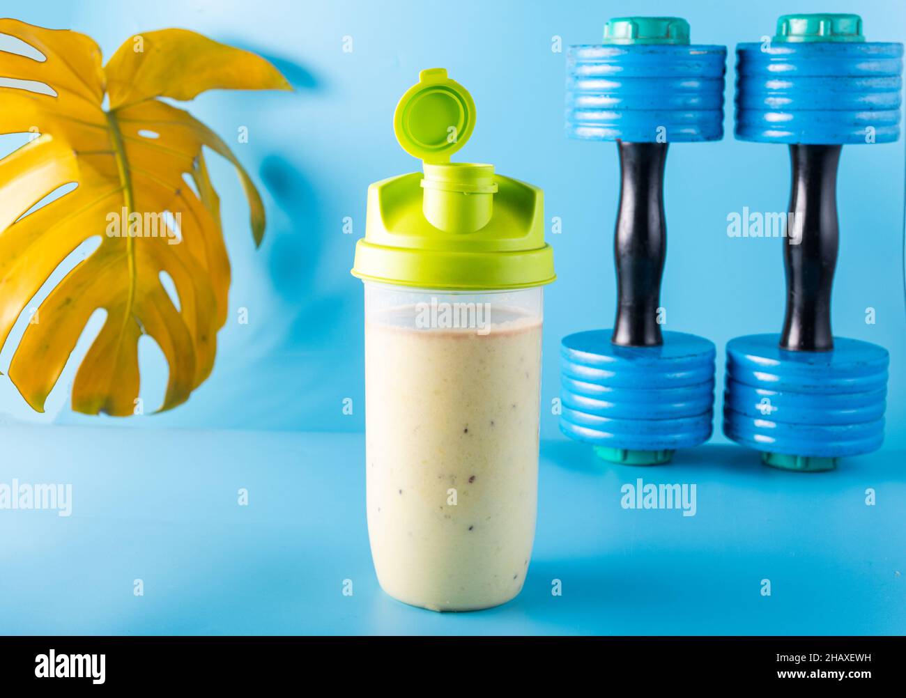 Protein sports shaker. Protein drink and dumbbells. Sports screensaver ...