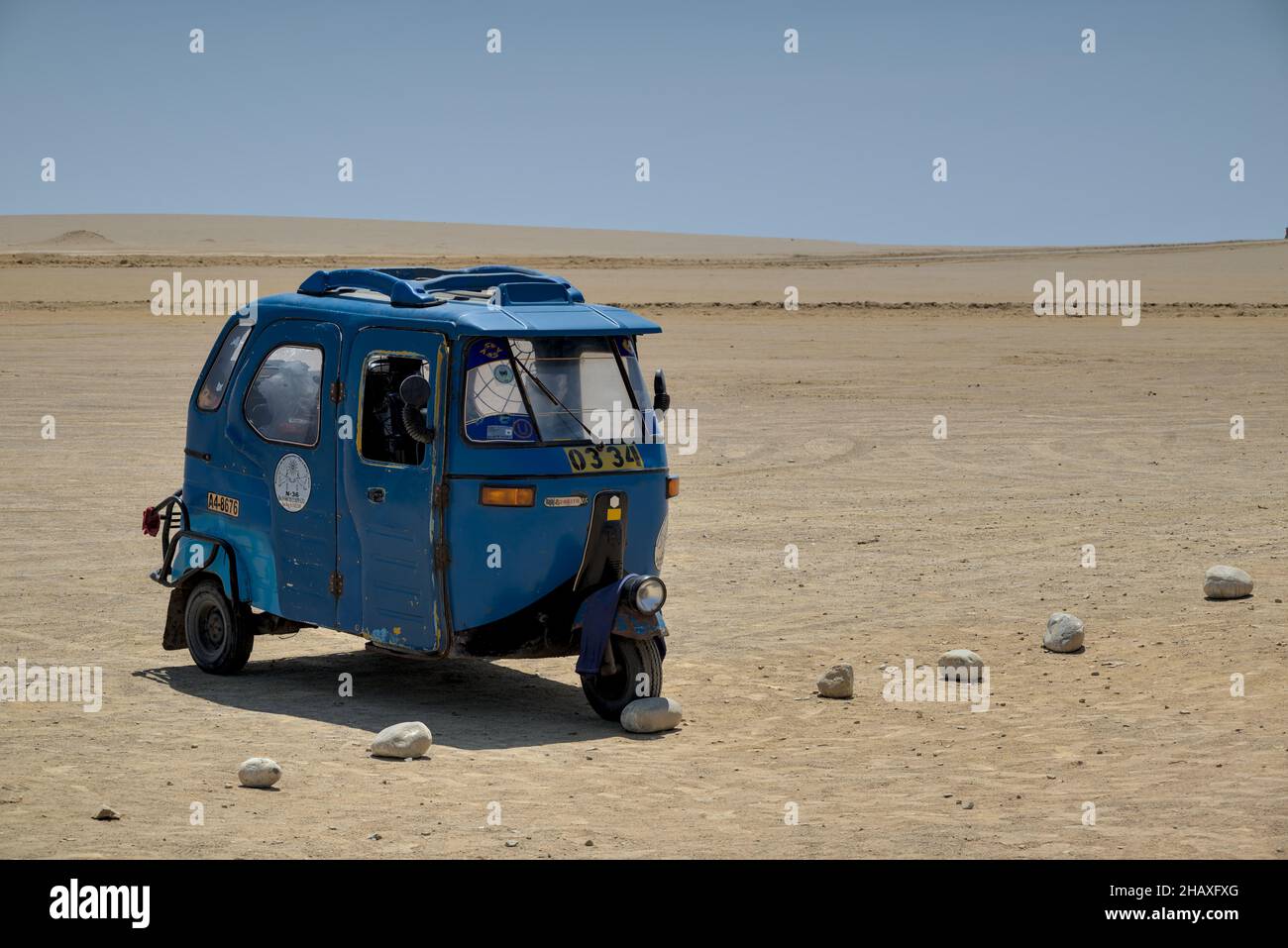 Blue tuk tuk three wheel taxi short distance transportation sits at ...
