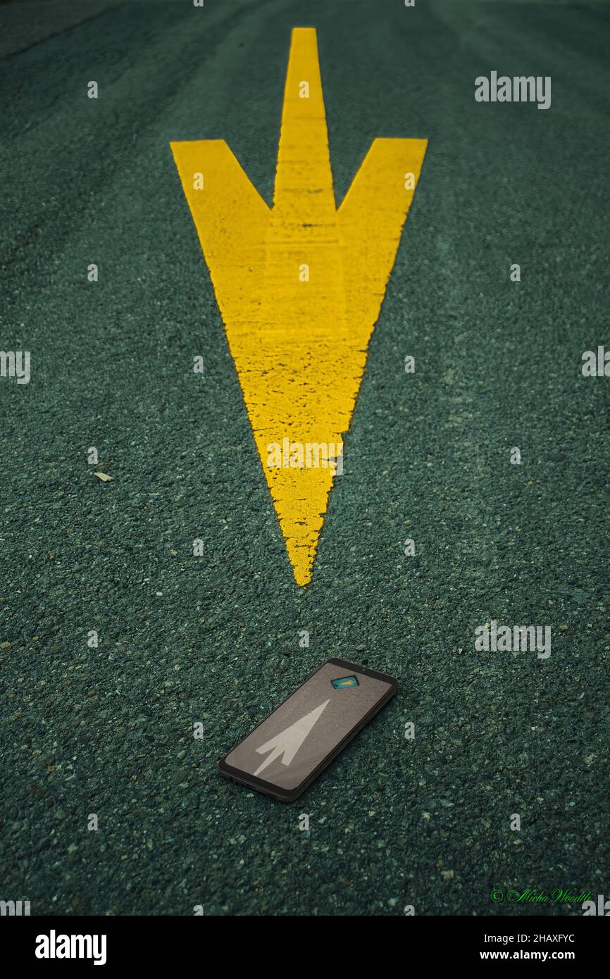 Vertical shot of an arrow sign as road markings on a street Stock Photo ...