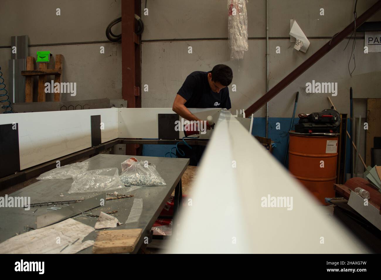 Worker riveting parts in a metal fabrication Stock Photo - Alamy