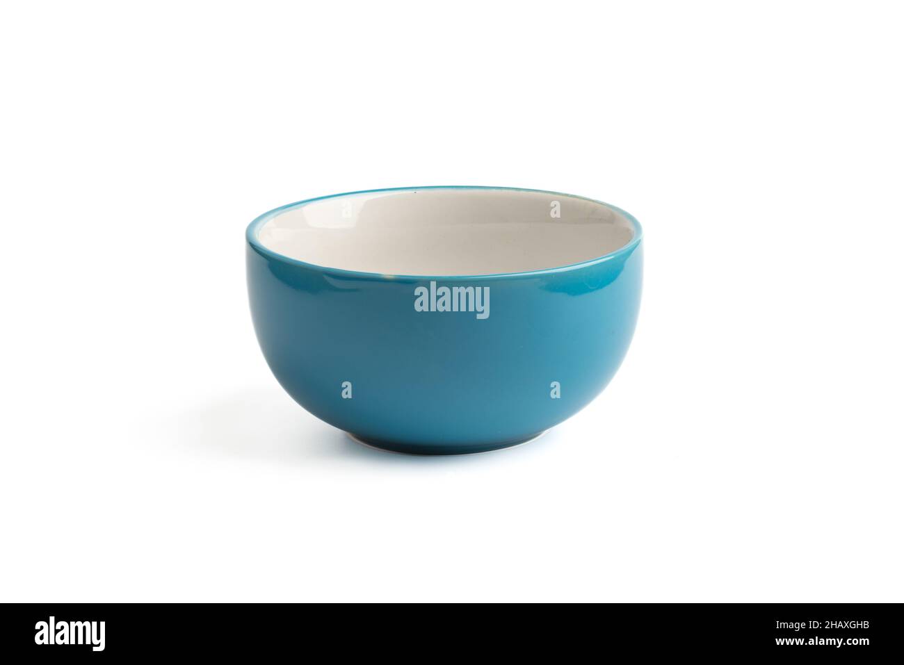 Blue ceramic salad bowl isolated on white background. Copy space Stock ...