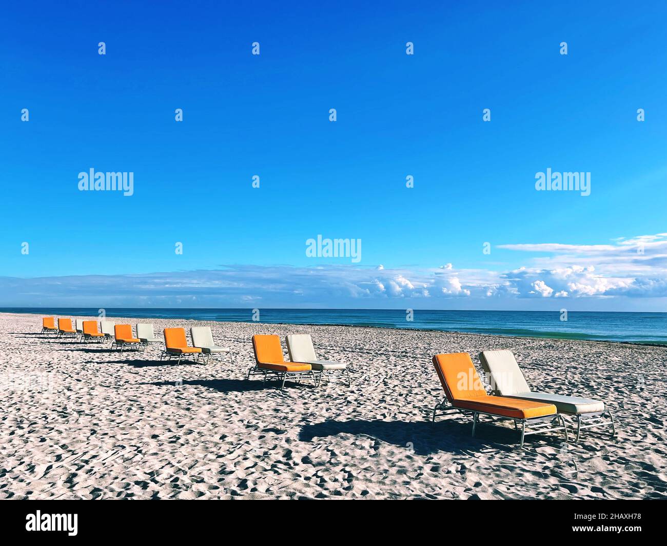 Rows of empty sun loungers on beach, Miami, Florida, USA Stock Photo ...