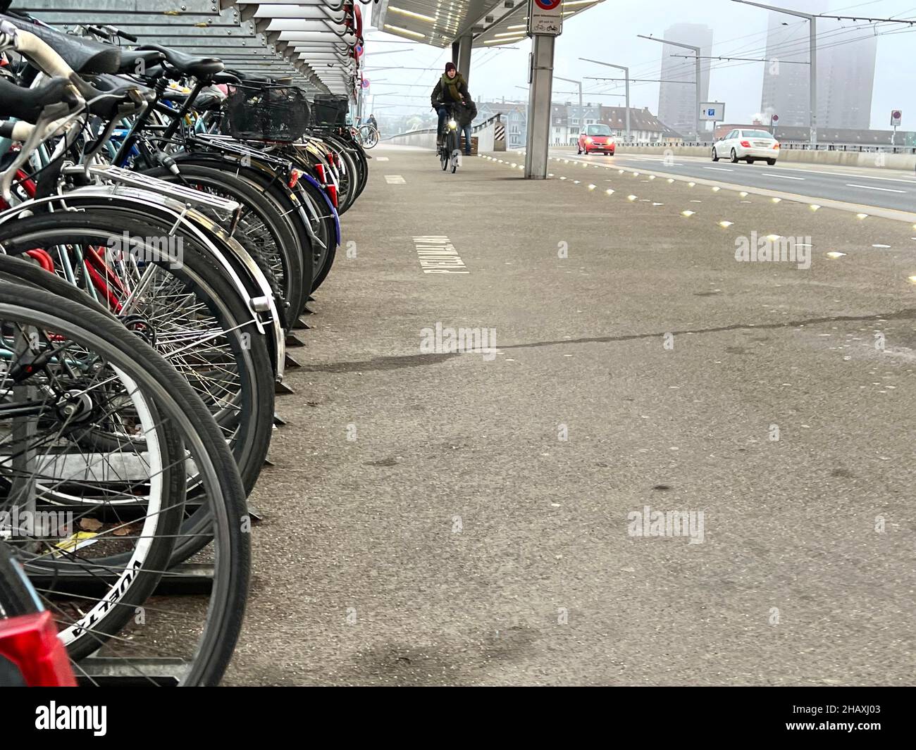 Bicycles parked at bus stop by the train station Hardbrücke in Zurich ...