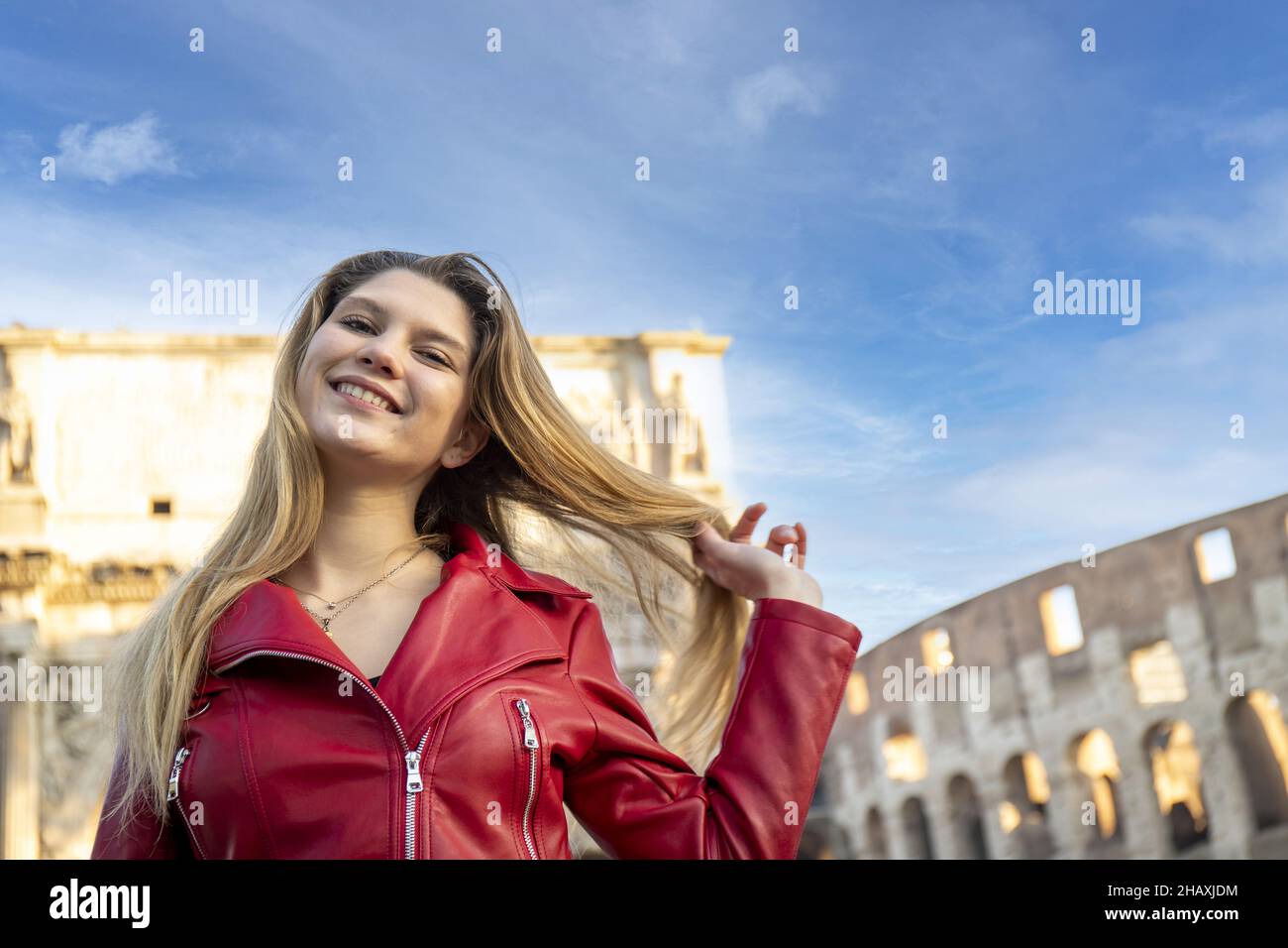 Young blond woman traveling to Rome. Beautiful woman smiling and posing ...