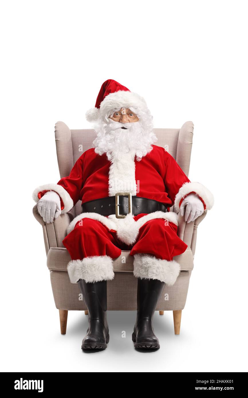 Full length portrait of santa claus resting in an armchair isolated on ...