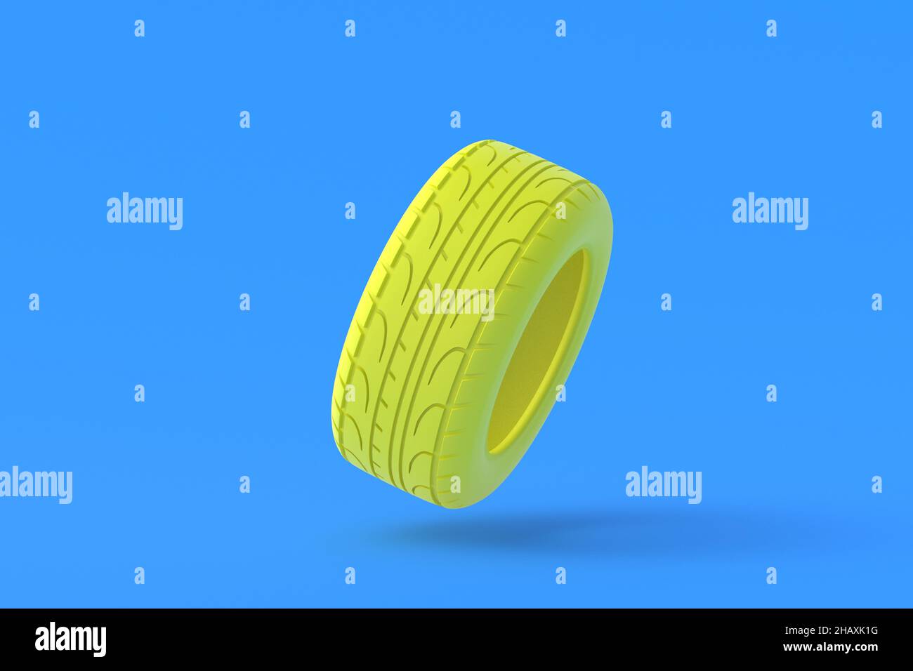 Car tyres of yellow color on blue background. Automotive parts. Traffic ...