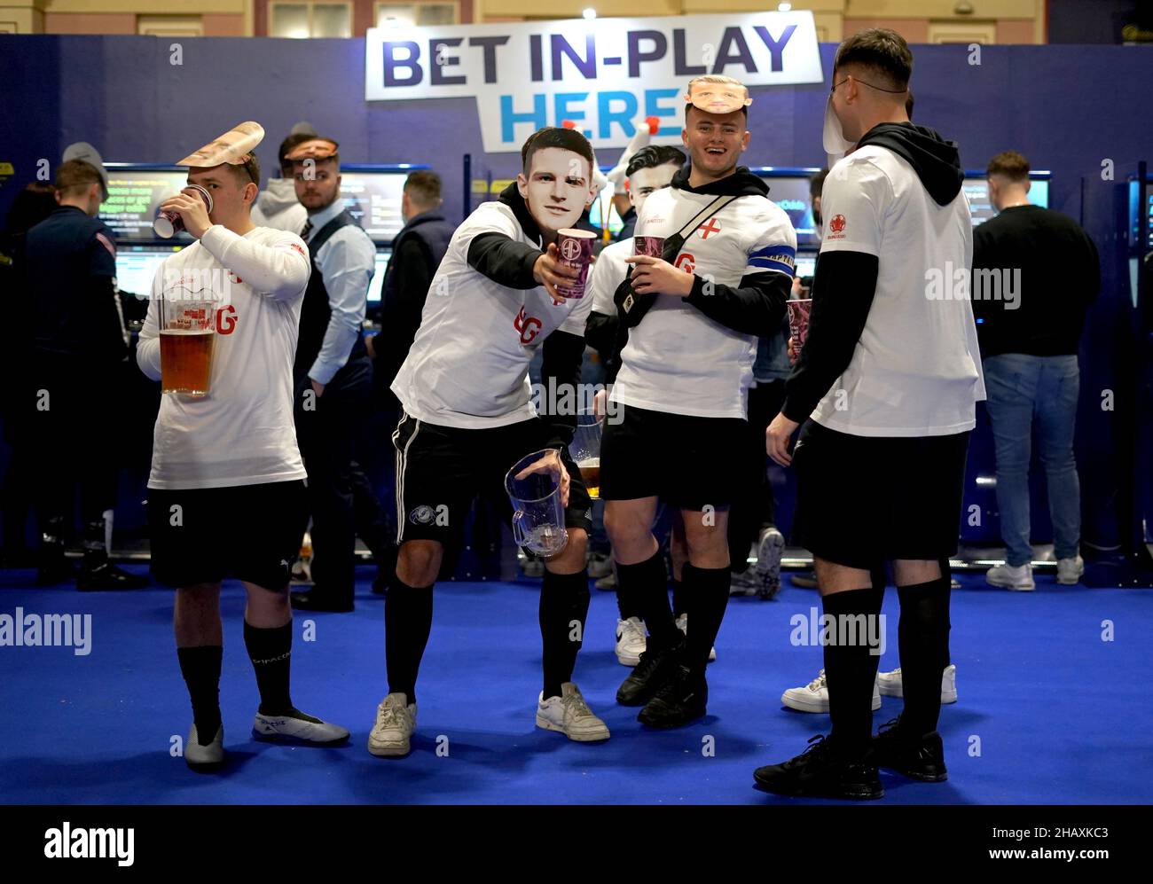 Darts fans wearing Kieran Trippier, Declan Rice and Harry Kane masks ...