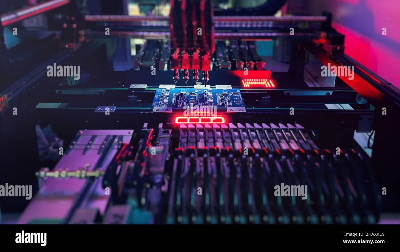 Digital technologies SMT automation industry. Red neon lights ...