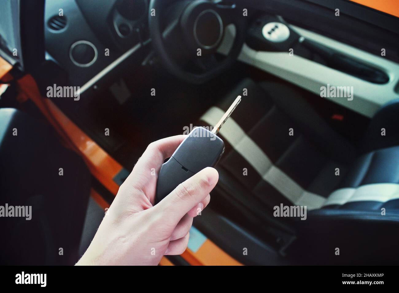 Keys in hand from a luxury car on the background of the car Stock Photo ...