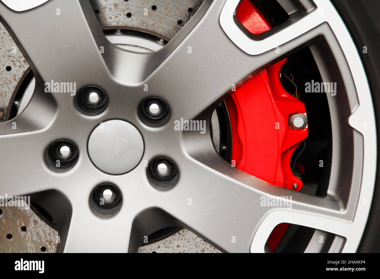 Car wheel. Brake discs. Red car caliper. Background. For advertising ...