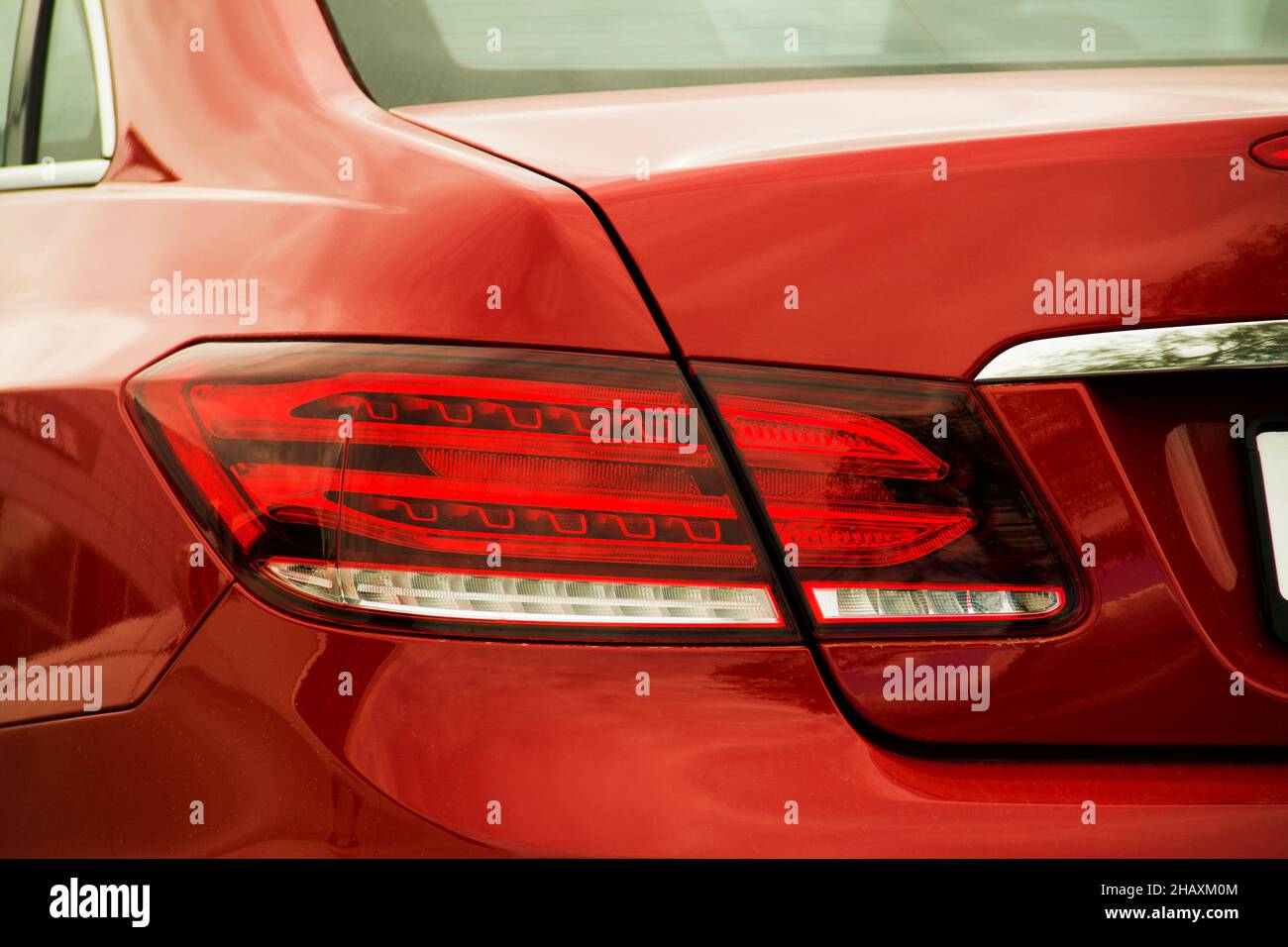 Red car. Car headlights. Luxury Headlights. Part of a red car Stock ...