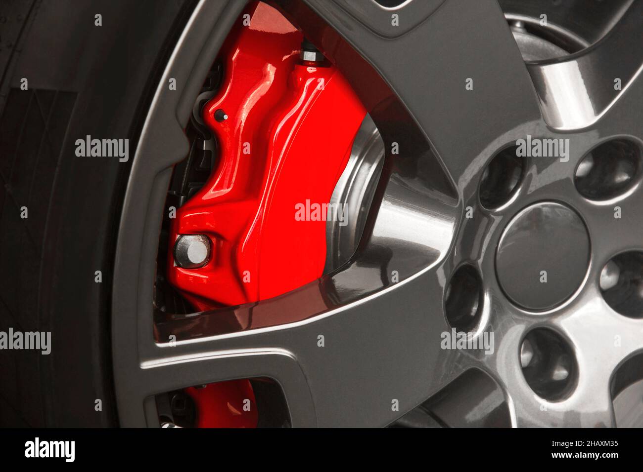 Car wheel. Brake discs. Red car caliper. Background. For advertising ...