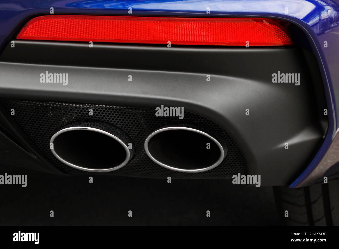 Car exhaust pipes. Car details. Part of the car. Blue Stock Photo - Alamy