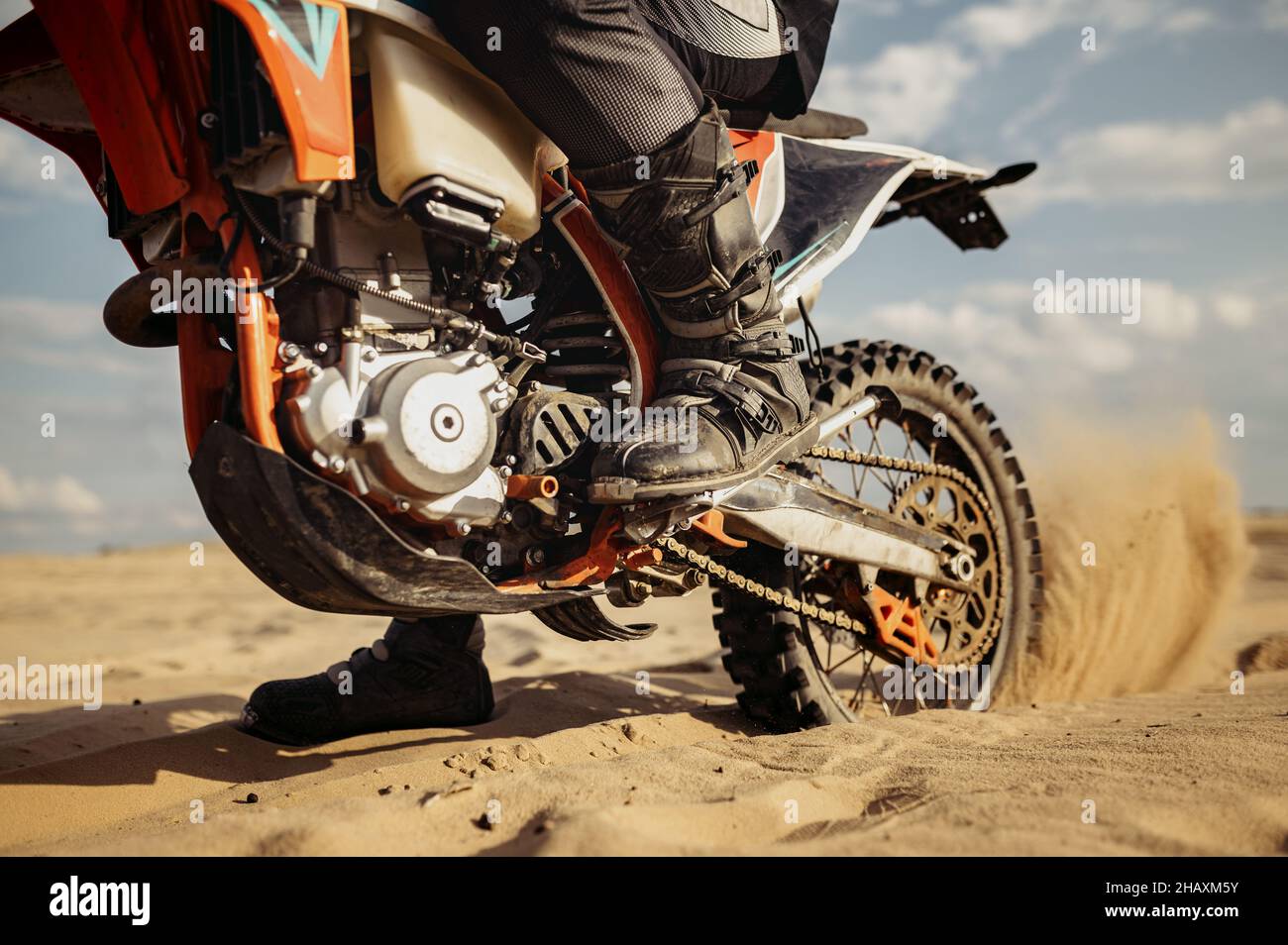 Rider driving in motocross race skid wheel Stock Photo - Alamy