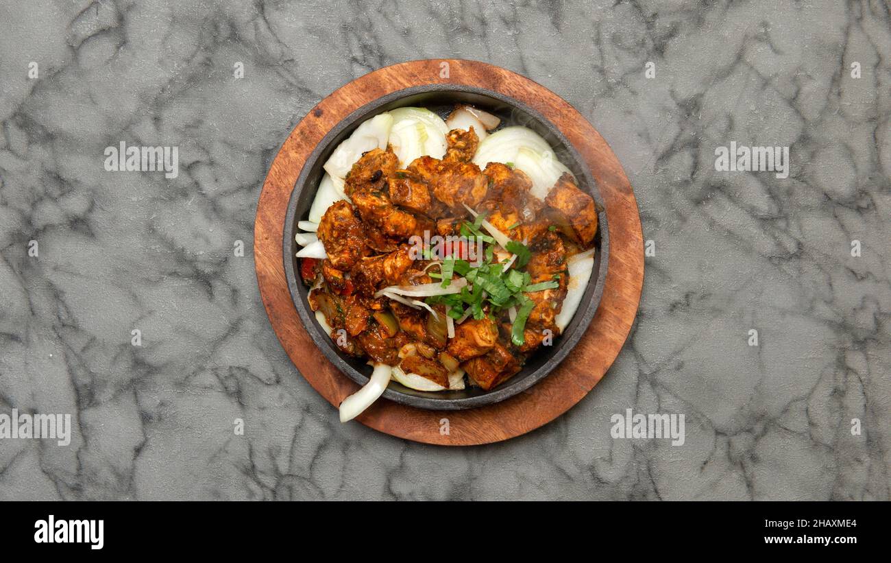 Chicken tak a tak Indian food Stock Photo - Alamy