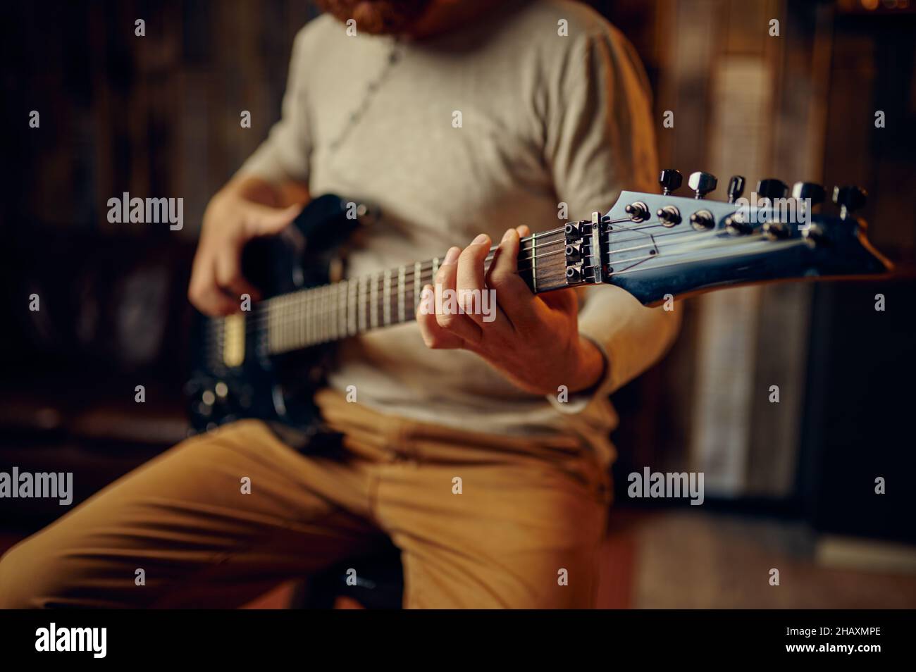 Young man playing electric guitar cropped shot Stock Photo - Alamy