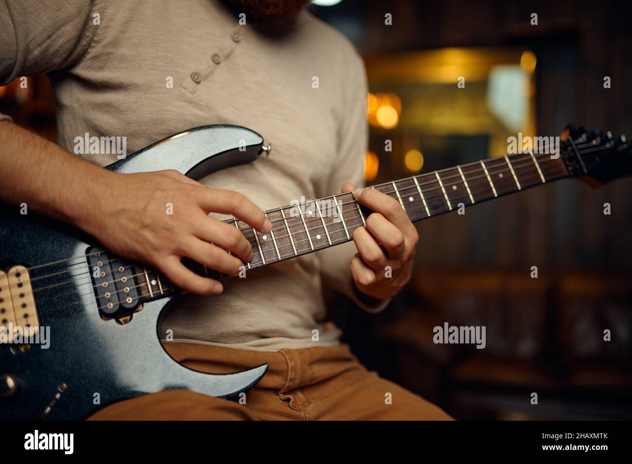 Young man playing electric guitar cropped shot Stock Photo - Alamy