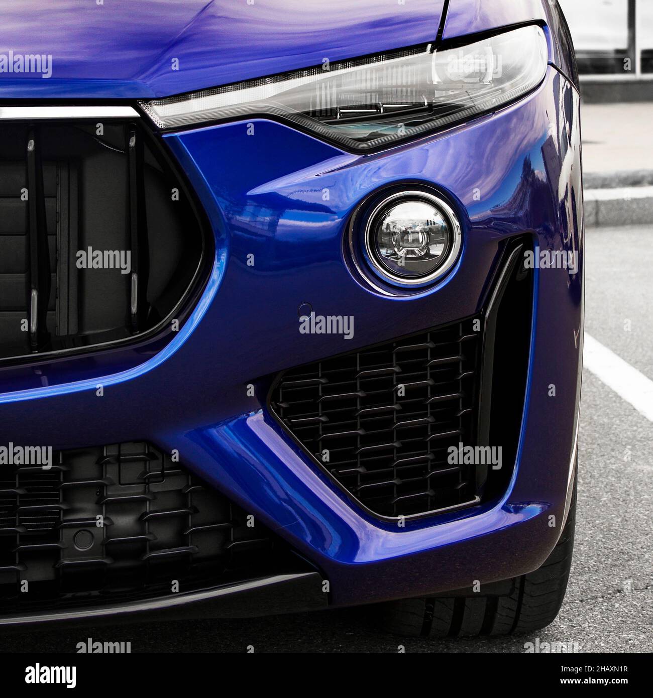 Part of a blue car close up. Car headlights. Luxury Headlights Stock ...