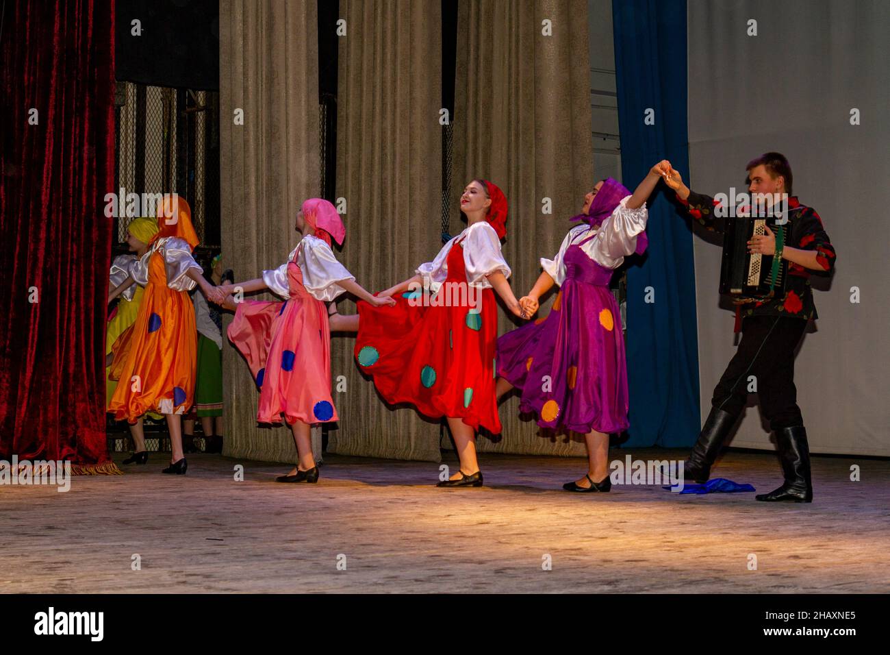 Omsk, Russia. 05 December, 2021. Bayan player and four girls-dancers ...