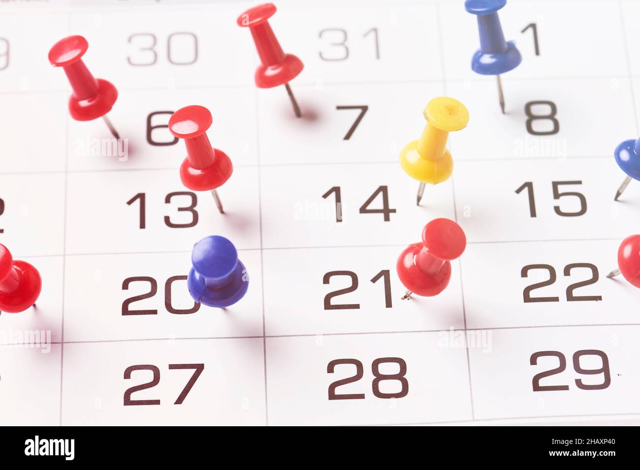 Colored push pins on monthly calendar page. Calendar appointments ...