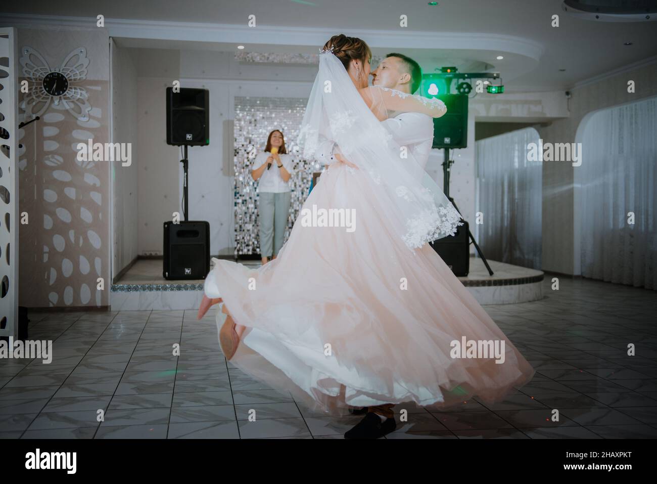 beautiful caucasian couple just married and dancing their first dance ...