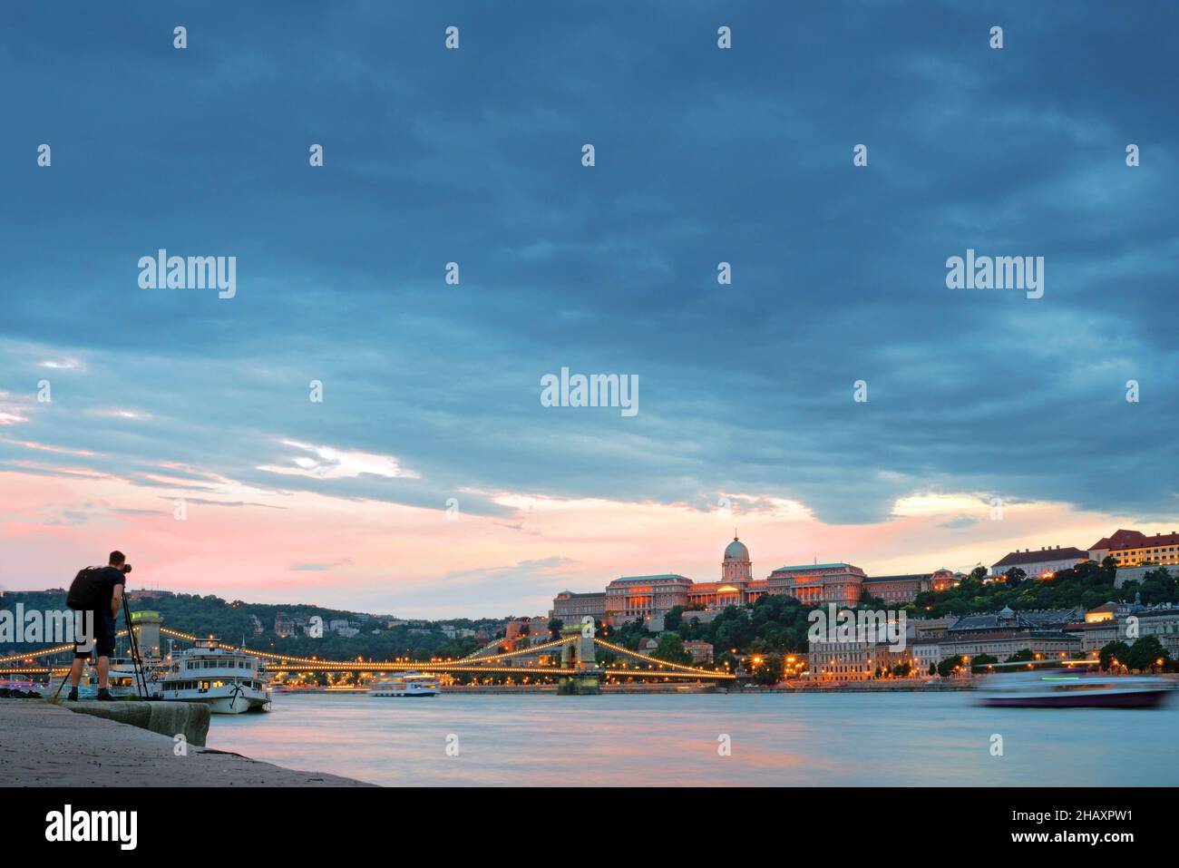 Budapest riverfront night view featuring photographer with tripod Stock ...
