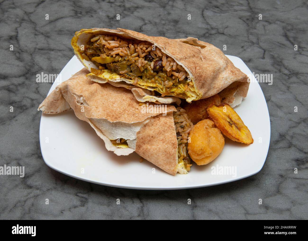 Curried goat wrap Jamaican & West Indian Food Stock Photo - Alamy