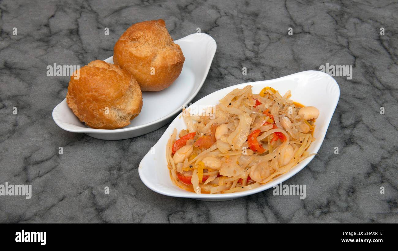 Saltfish rundown with cabbage Jamaican & West Indian Food Stock Photo ...
